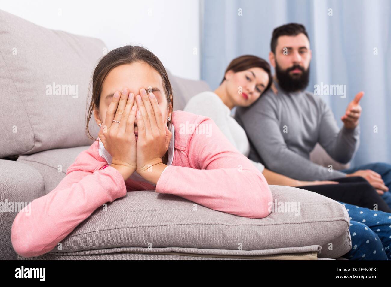Young father and mother correcting their child for disobedience Stock ...