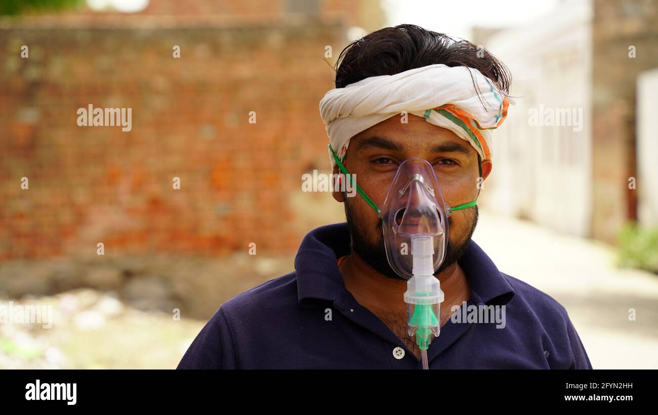 Jaipur, India - May 2021: Young attractive man with oxygen mask looking ...