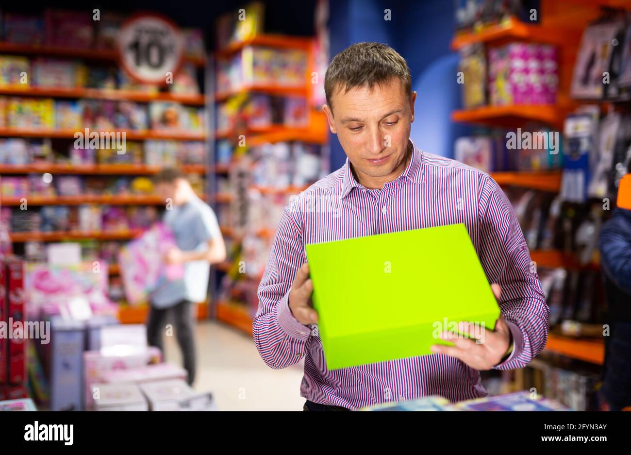 Father and children in toy store hi-res stock photography and images ...
