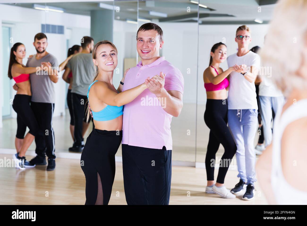 young couples enjoying of partner dance and smiling indoor Stock Photo ...