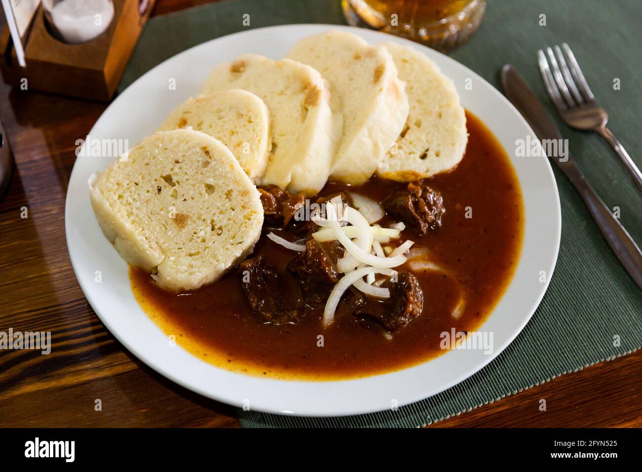 Appetizing goulash with potato dumplings. Traditional czech dish Stock ...