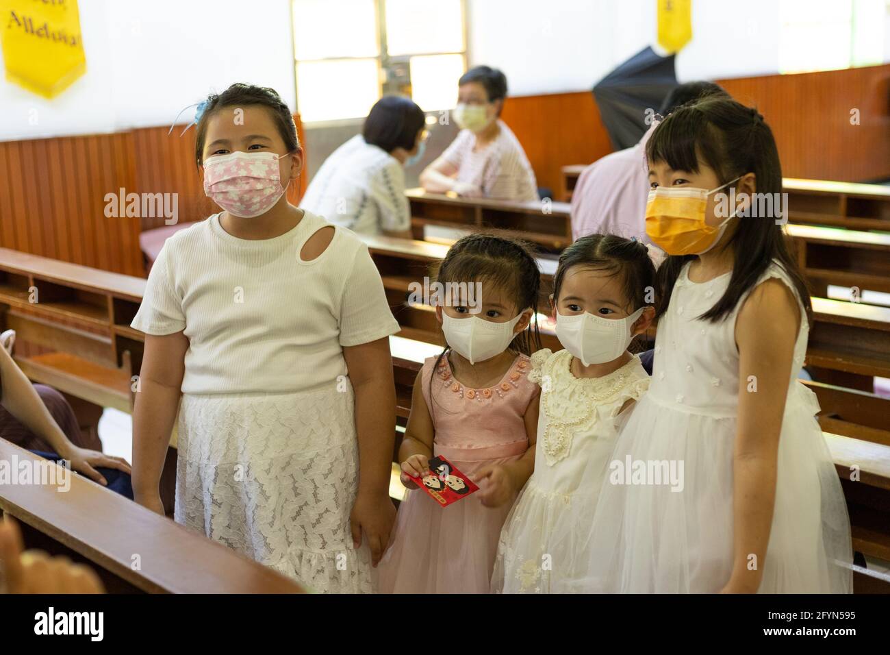 Two pretty girls in church hi-res stock photography and images - Alamy