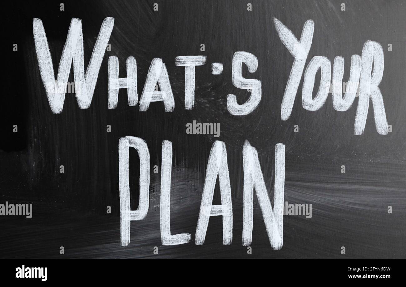 Closeup shot of a white text "What's Your Plan" on a black surface ...