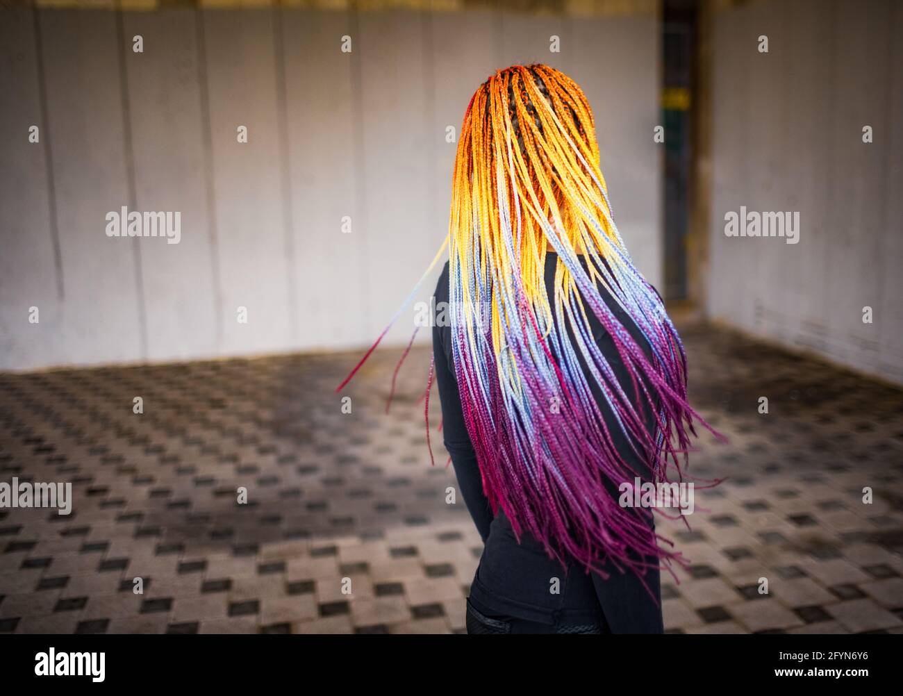 Fashionable unknown girl in an elegant beige jacket with multi-colored ...