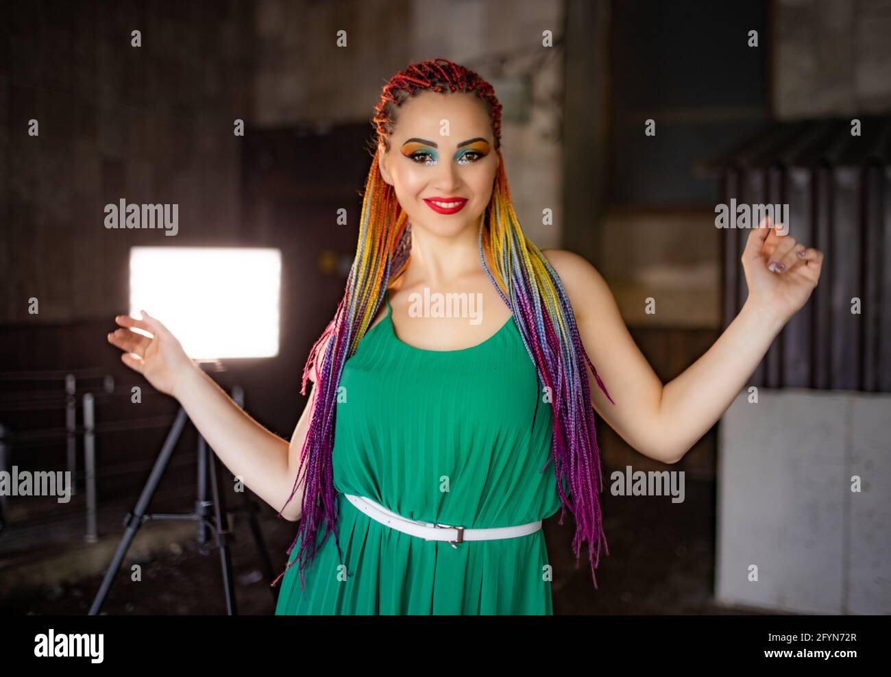 A sweet girl with very bright eyeshadows and sparkles with iridescent ...