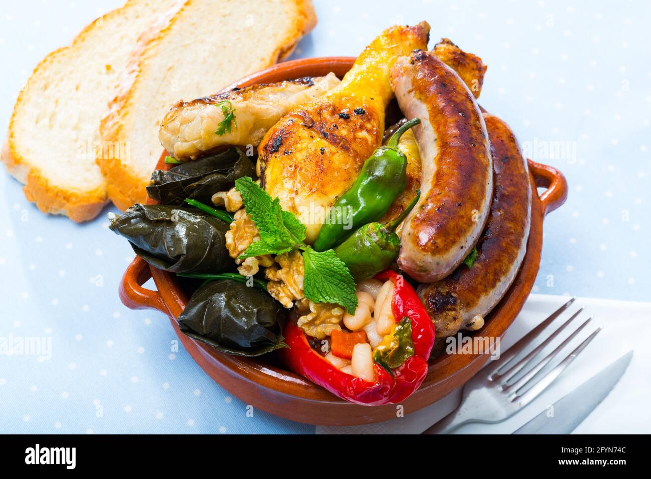 Traditional Bulgarian dish Kapama – sausages, cabbage rolls, dolma and ...