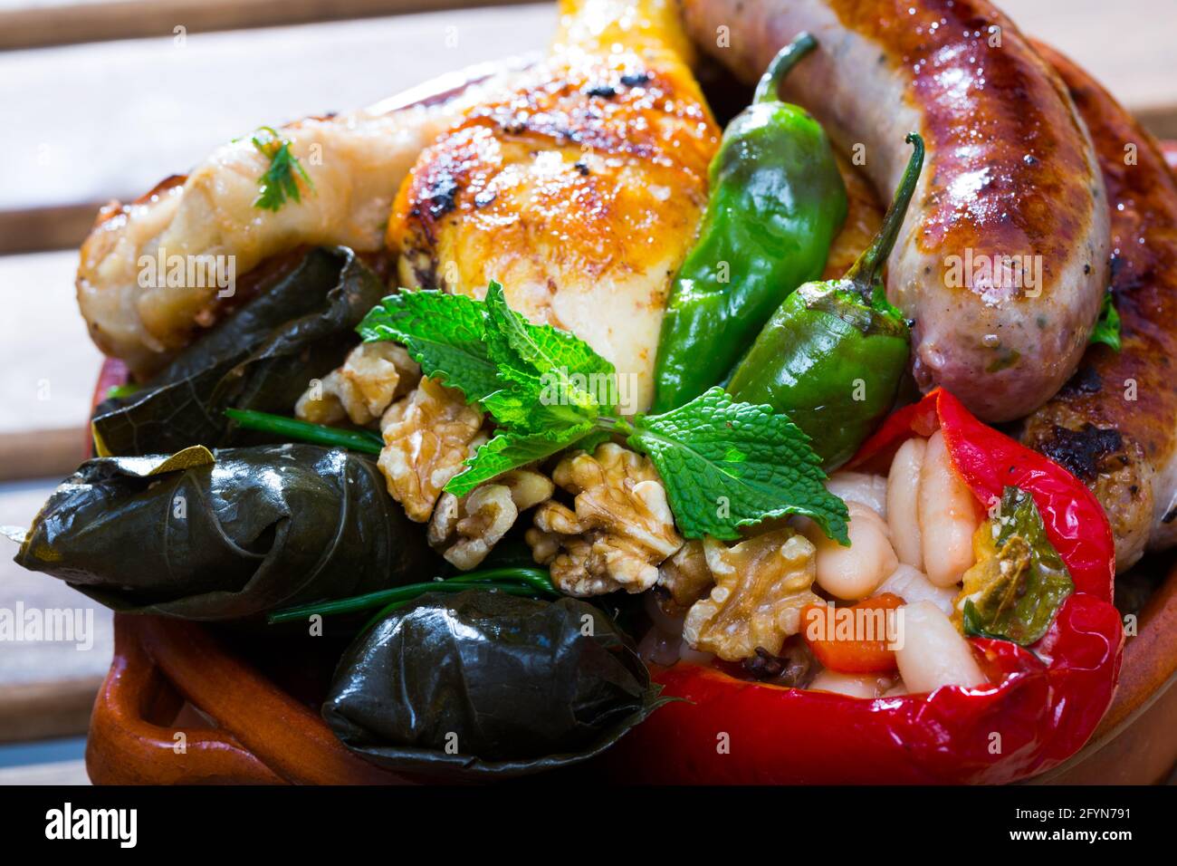 Traditional Bulgarian dish Kapama – sausages, cabbage rolls, dolma and ...