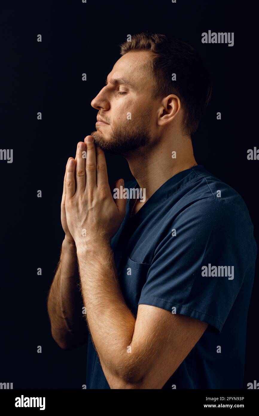 Man cover his face with his hands and thinks about life. Handsome man ...