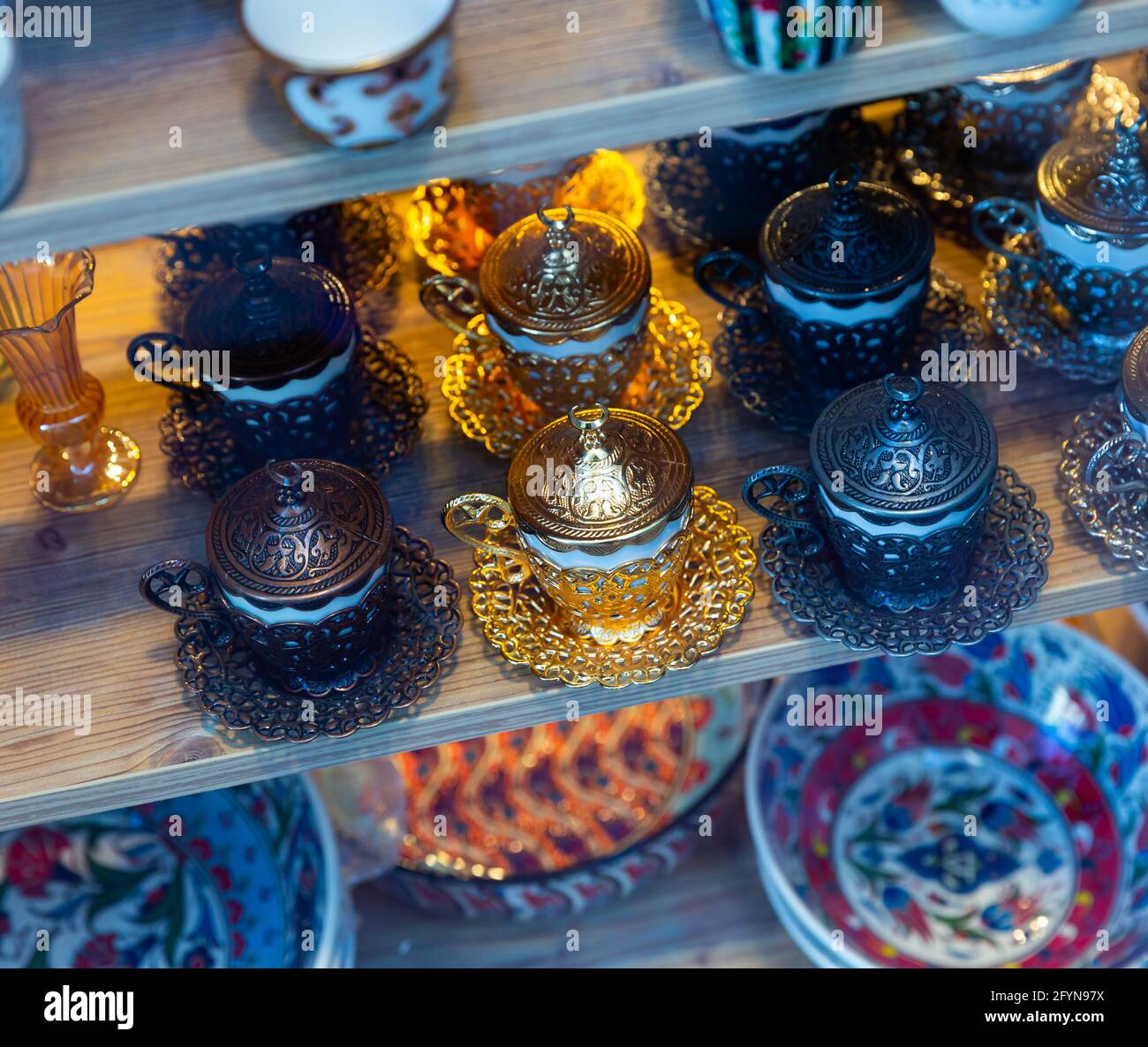 Variety of traditional colorful handcrafted tea and coffee cups on ...