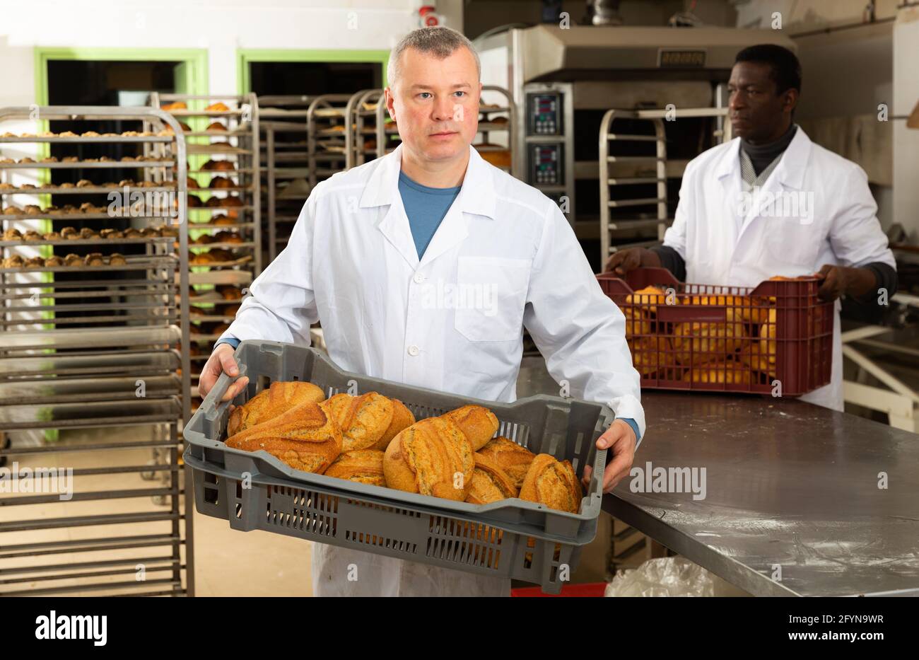 Successful baker during daily work in bakeshop Stock Photo - Alamy
