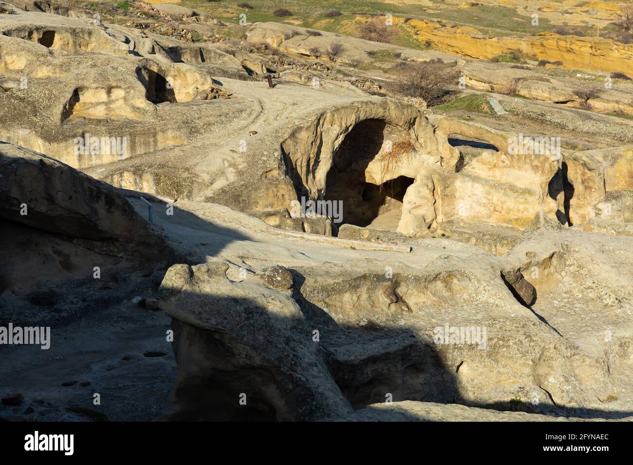 Complex of cave structures carved into mountain in historic city of ...