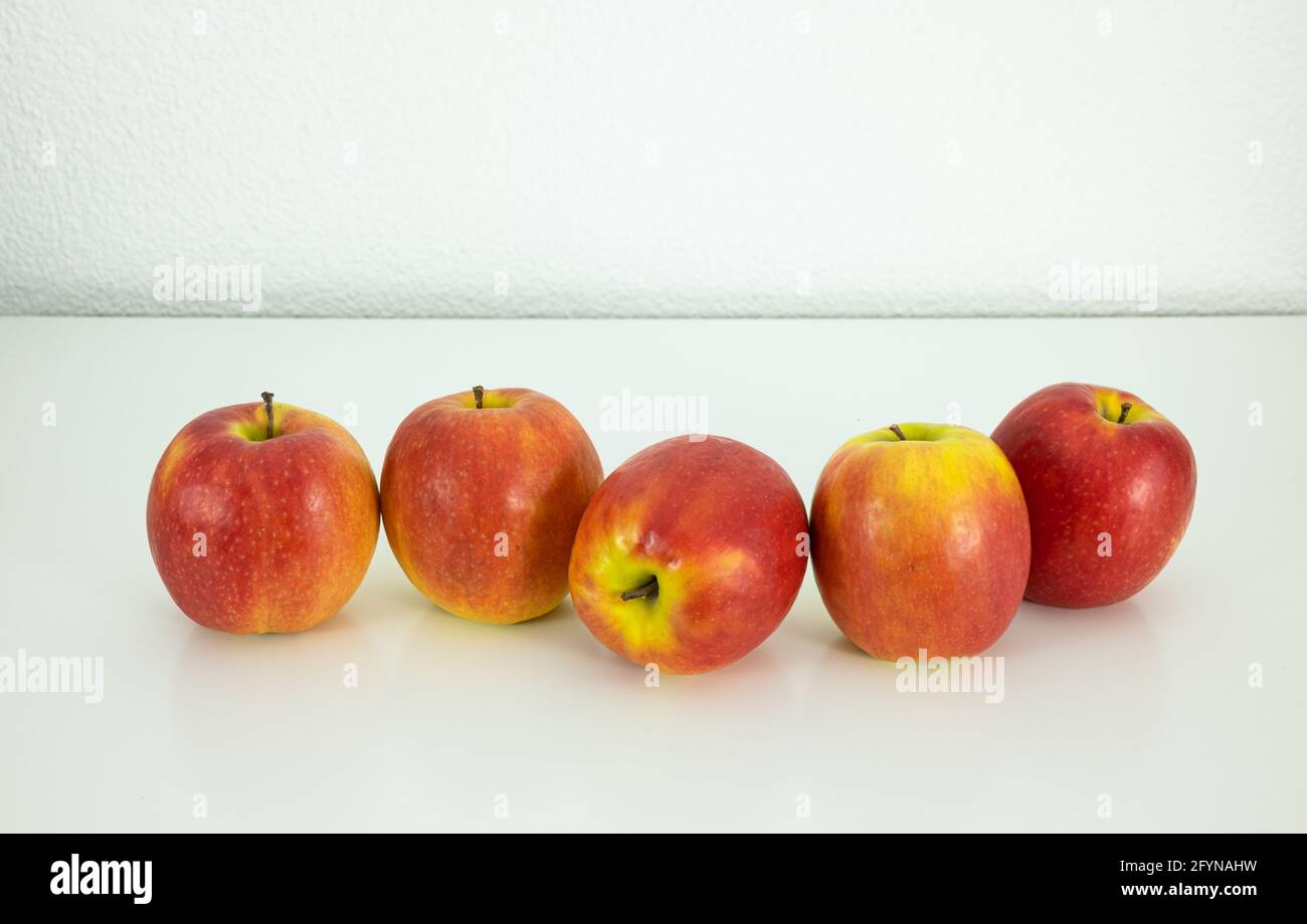 Five red-yellow juicy ripe apples on the white background Stock Photo ...