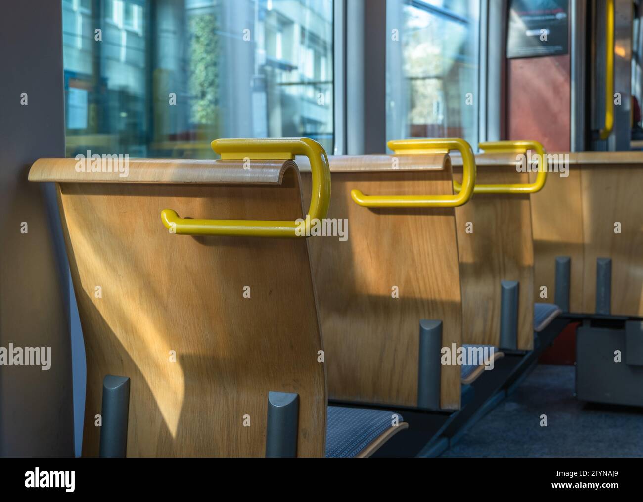 Empty wooden seats in the urban tram car in Zurich Stock Photo - Alamy
