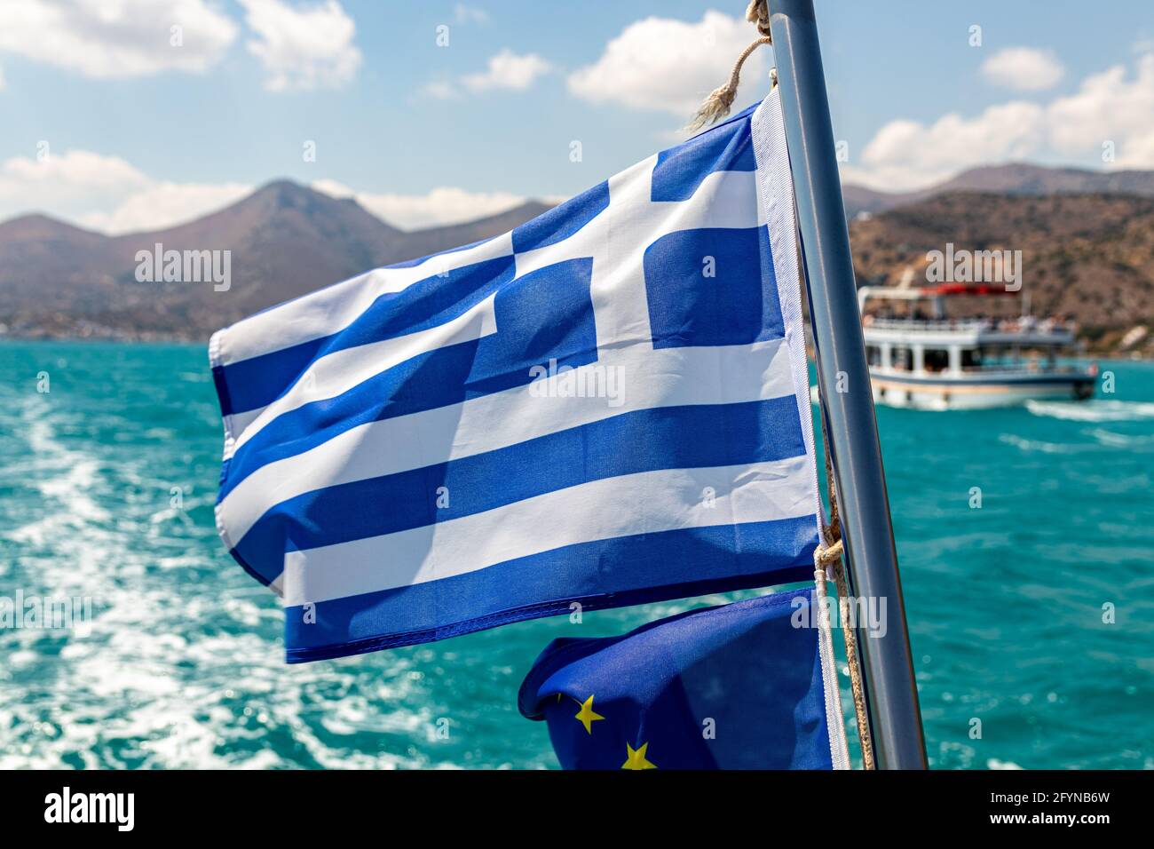 A waving flag of Greece on a ship off the Greek coast Stock Photo - Alamy