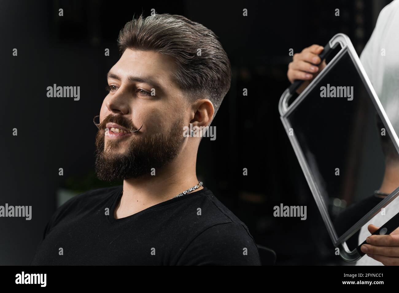 Hairdresser showing hair cut in hi-res stock photography and images - Alamy