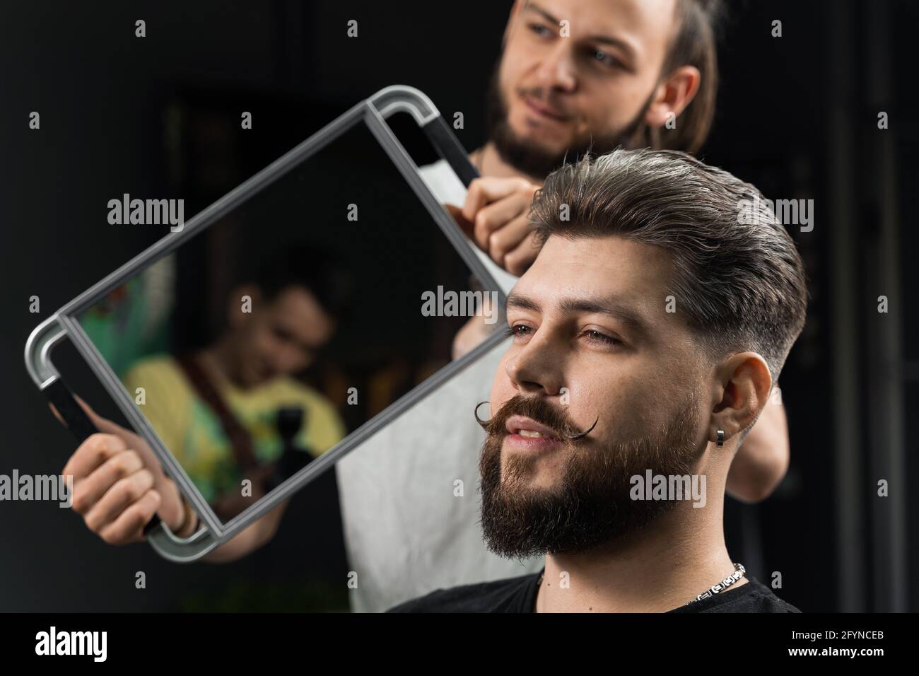 Hairdresser showing hair cut in hi-res stock photography and images - Alamy