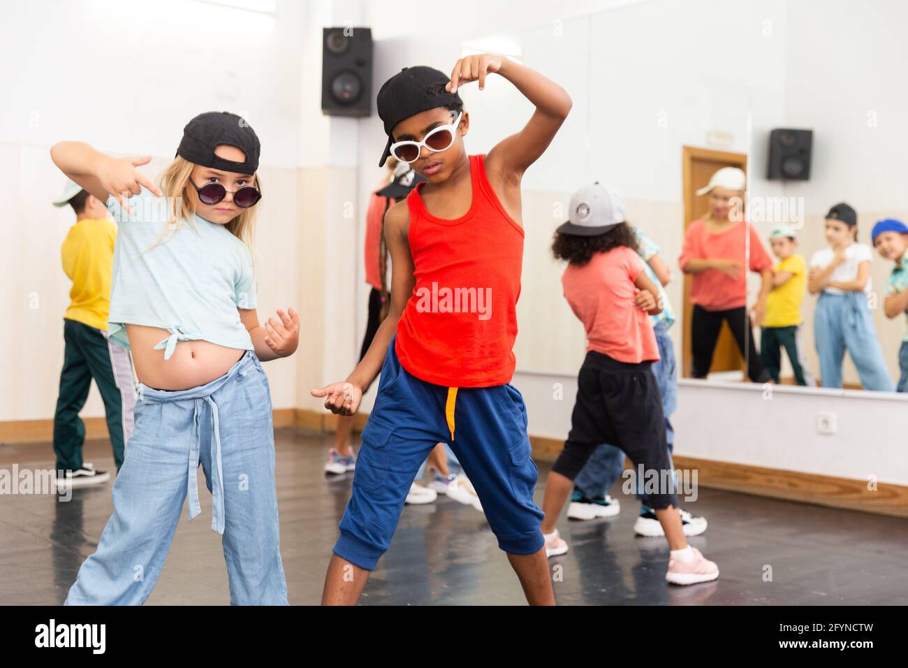 Portrait of confident preteen white girl and afro boy breakdancers in ...