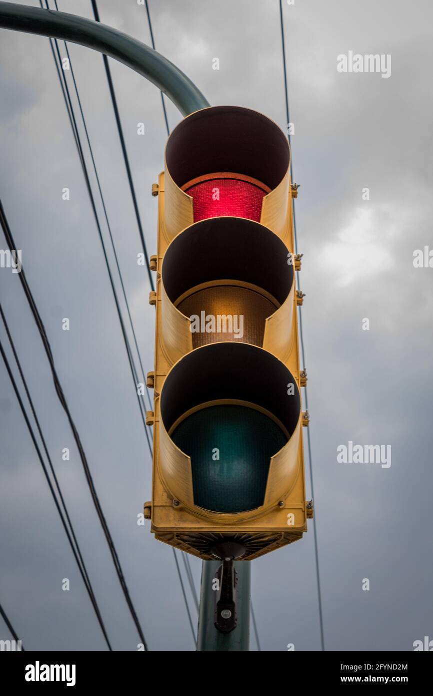 Low-angle shot of the traffic lights showing the red color against the ...