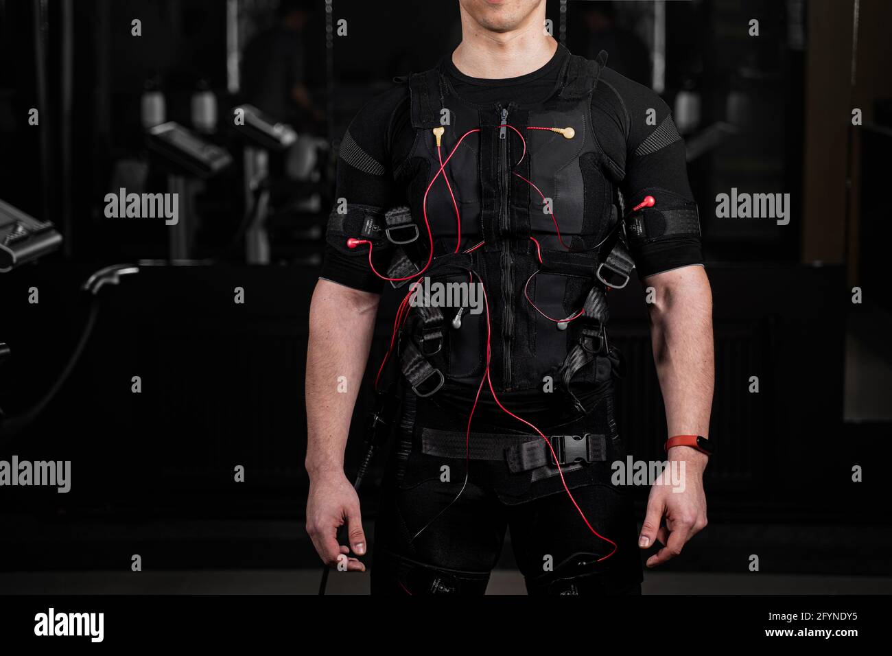 EMS suit with red wires for electro impulse stimulation for body ...