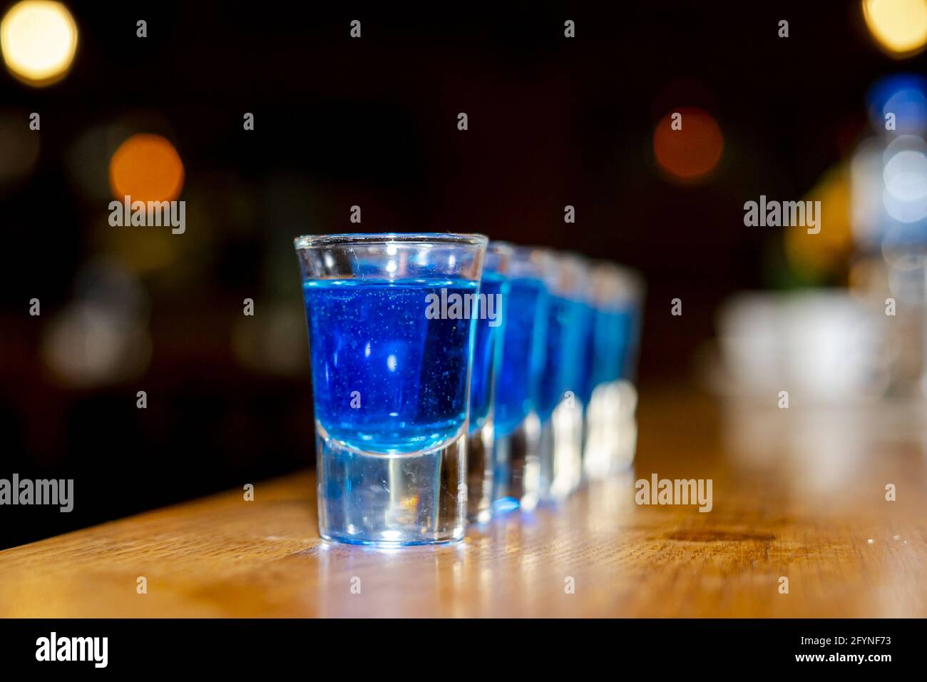 Row of deep ocean shots on a bar Stock Photo - Alamy