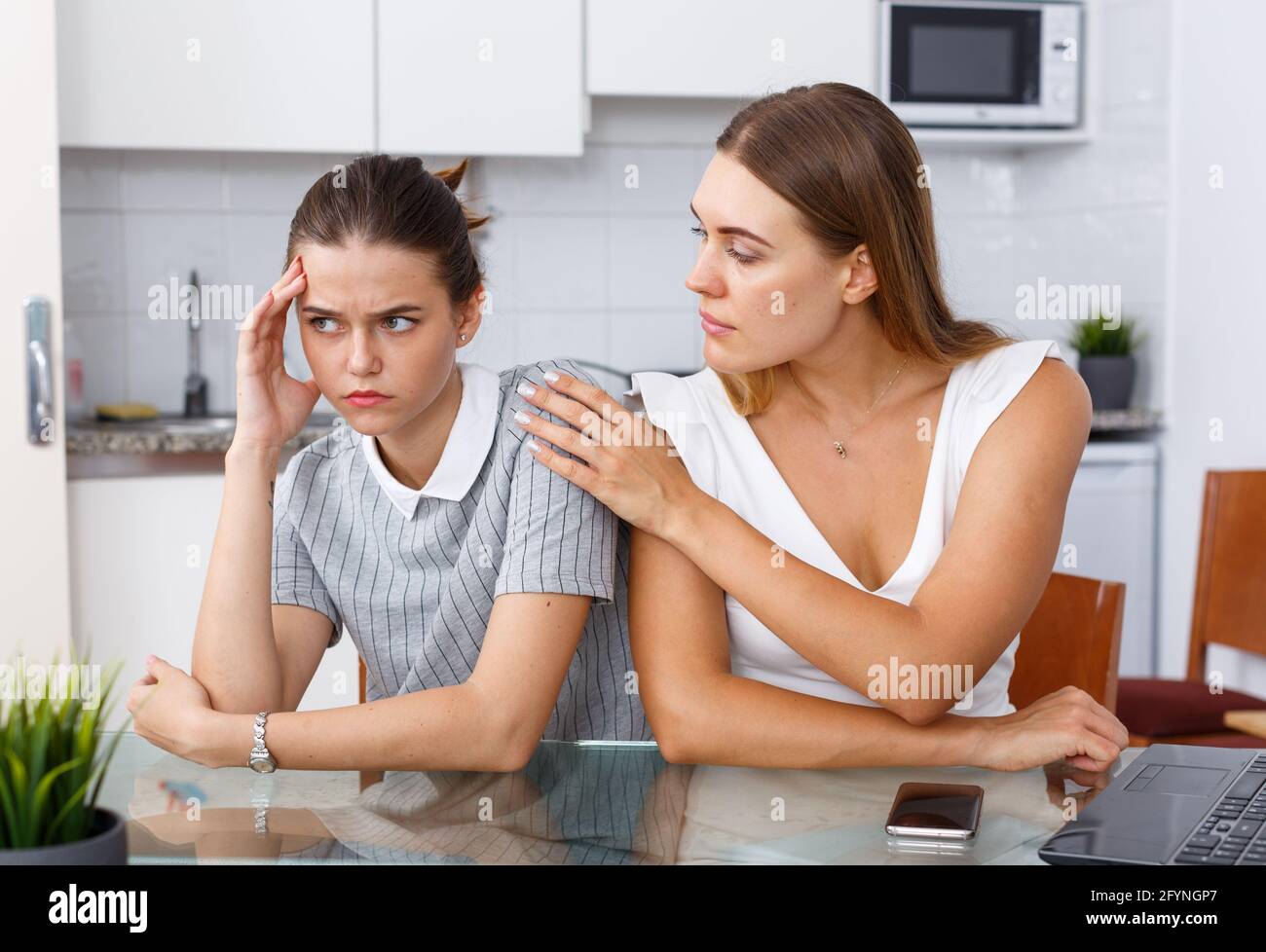 Girl embracing and supporting her upset friend in difficult life ...