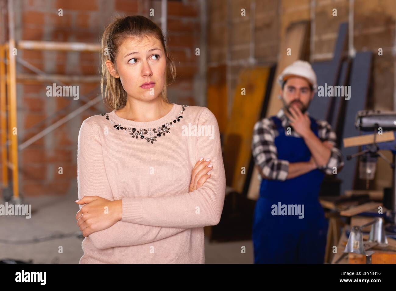 Customer upset with the work of the builder Stock Photo - Alamy