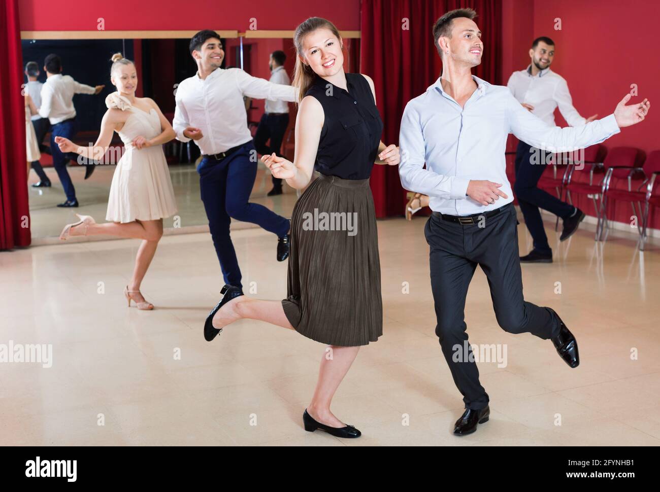 Happy cheerful people dancing twist in pairs Stock Photo - Alamy