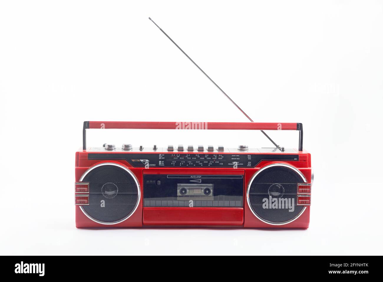 Red vintage Cassette player with open antenna isolated on white ...