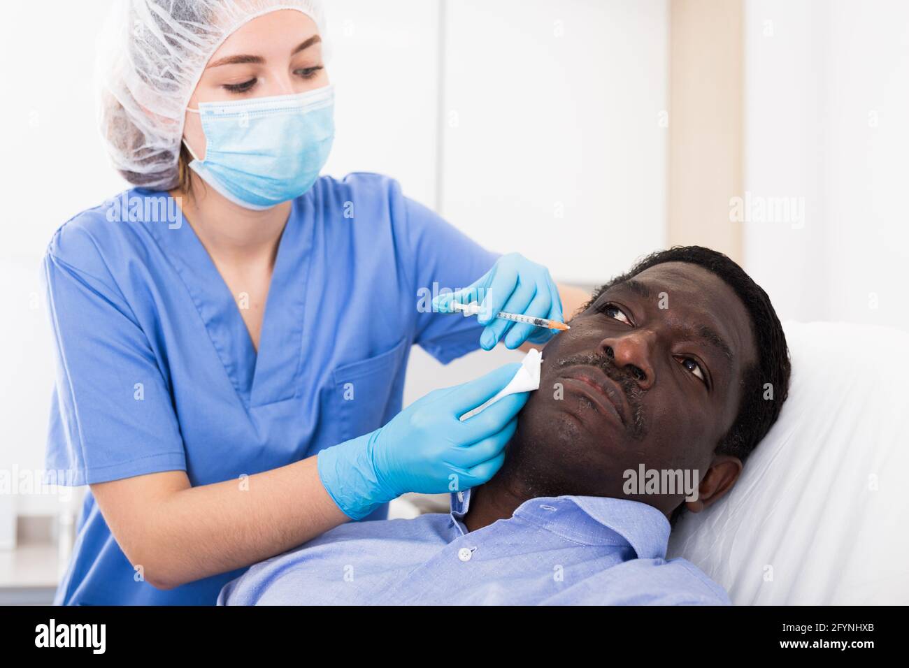 Portrait of african american male client of aesthetic cosmetology ...