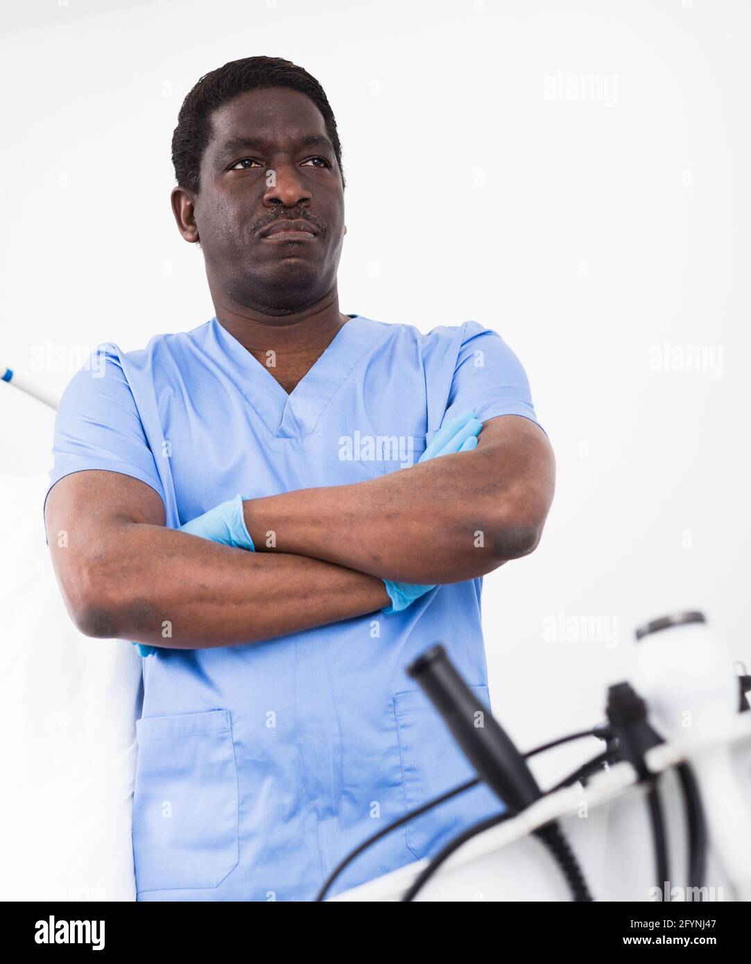 Portrait of confident professional african american male cosmetologist ...