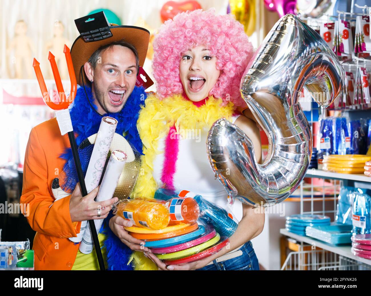 Family couple preparing for fest choosing firecrackers and smiling ...