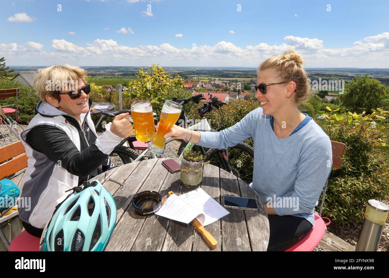 Uttenweiler Offingen, Germany. 29th May, 2021. Mother and daughter sit ...