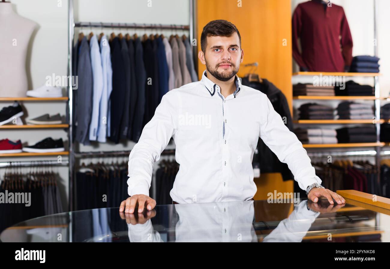 Young male business owner in clothes shop hi-res stock photography and ...