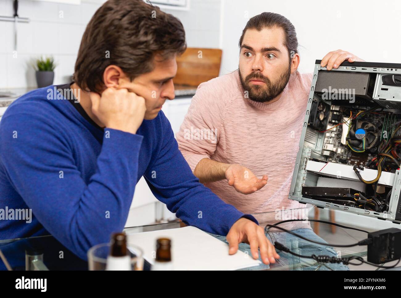Men do not know how to repair a computer Stock Photo - Alamy
