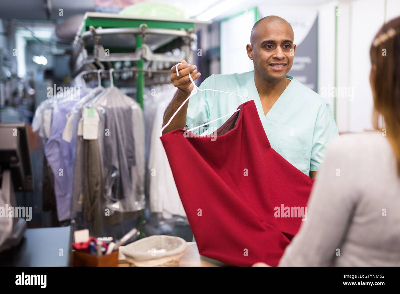 Drycleaner customer hi-res stock photography and images - Alamy