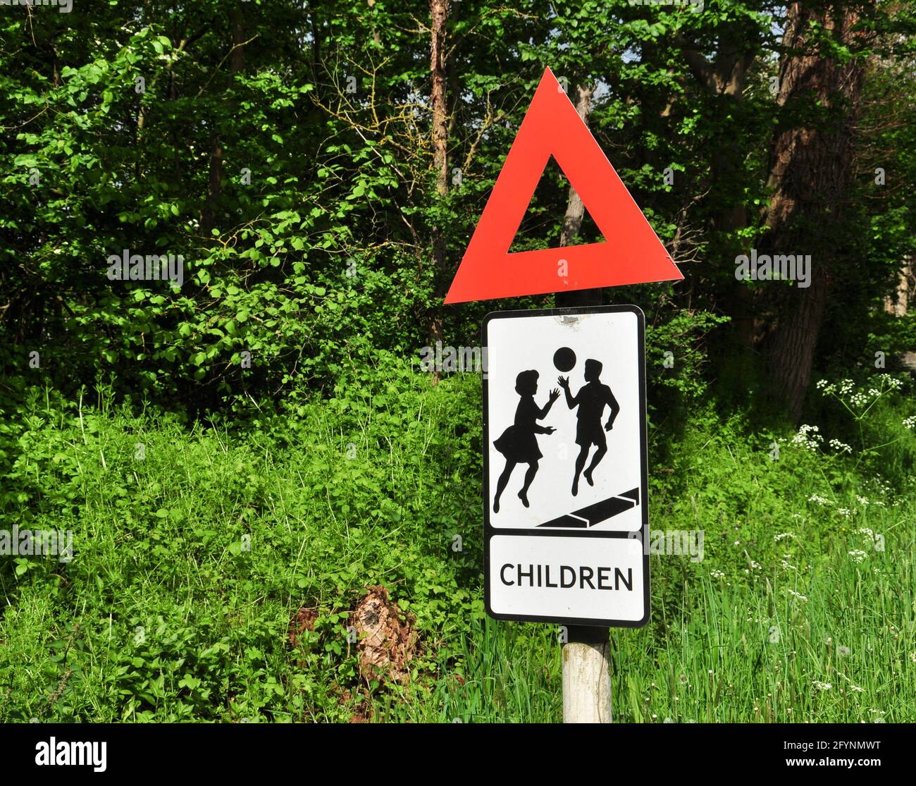 Old fashioned road sign 'children playing' with traditional warning ...