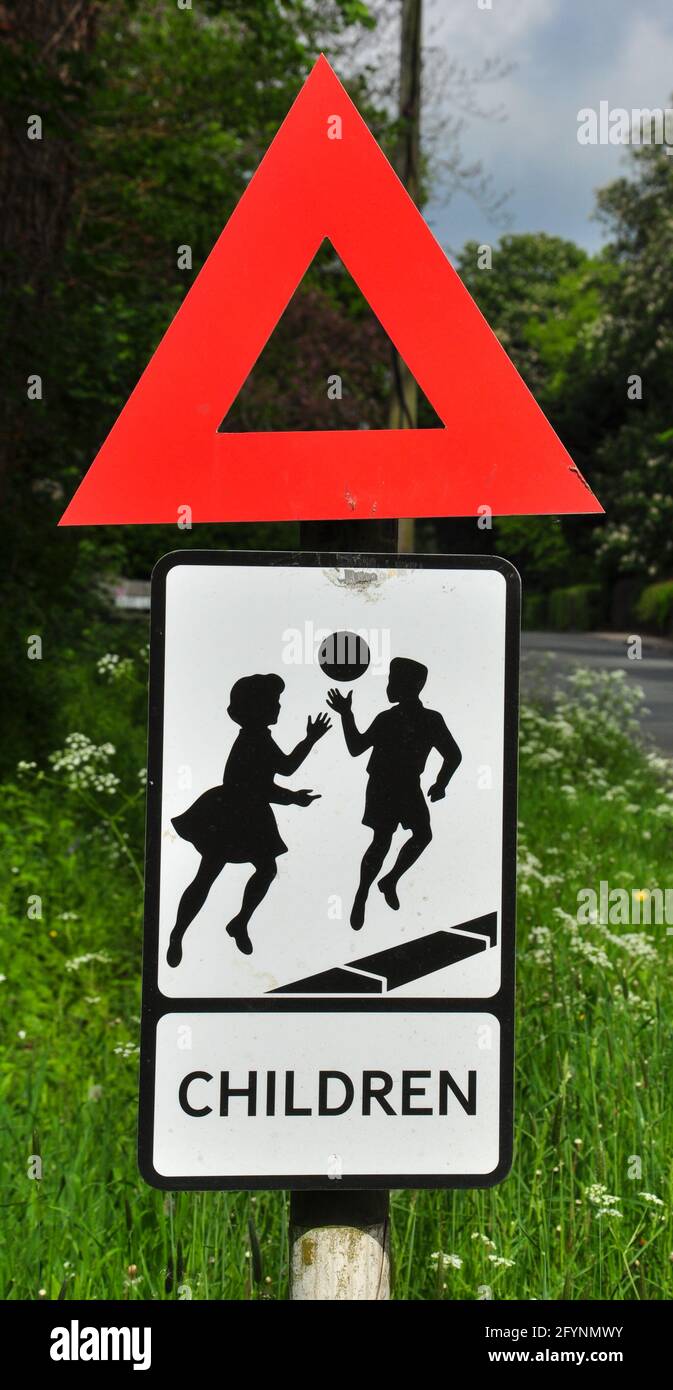 Old fashioned road sign 'children playing' with traditional warning ...