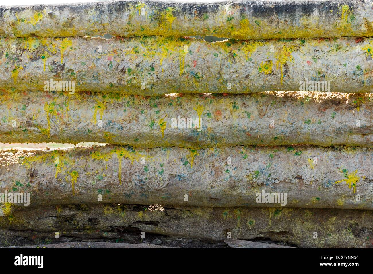 Closeup of wooden barriers with paint splashes on paintball playground ...