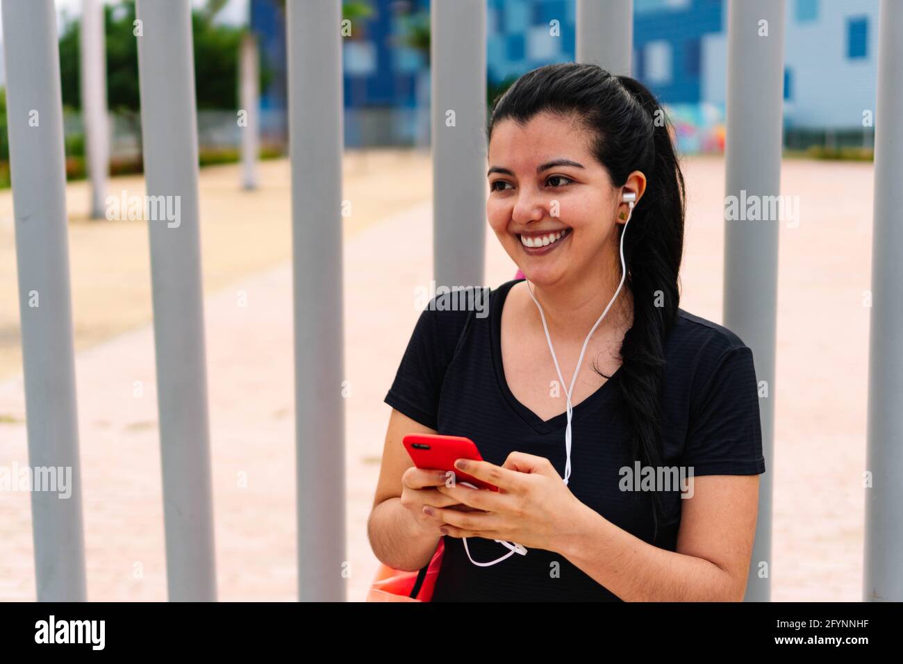 Checking the time running hispanic hi-res stock photography and images ...