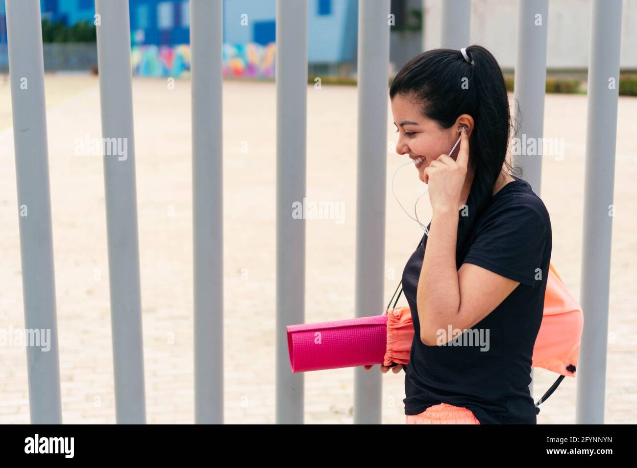 Hispanic woman in shape, walking outdoors Stock Photo - Alamy
