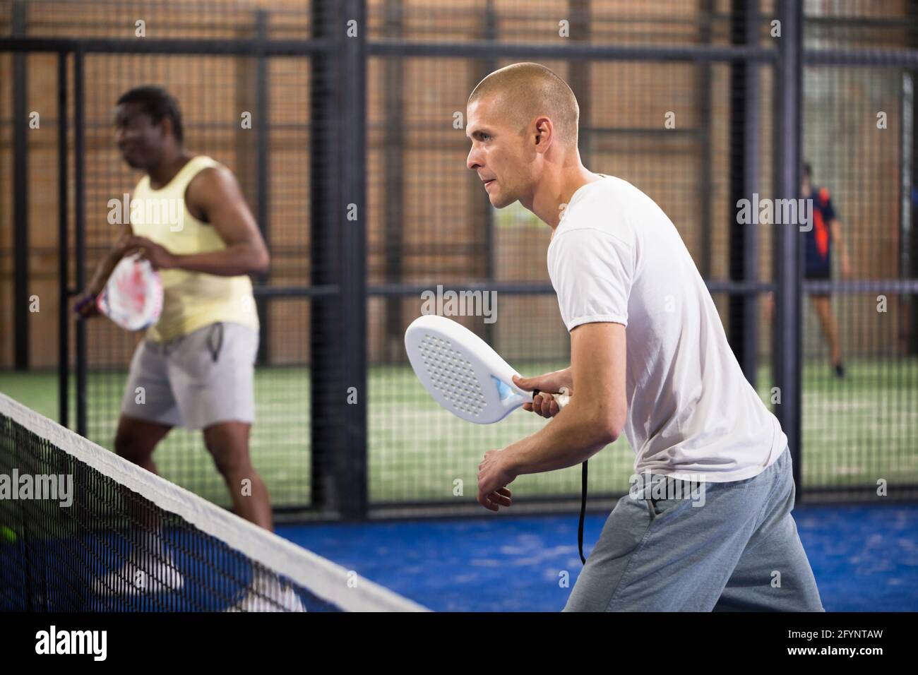 Man playing padel tennis on the padel court Stock Photo - Alamy