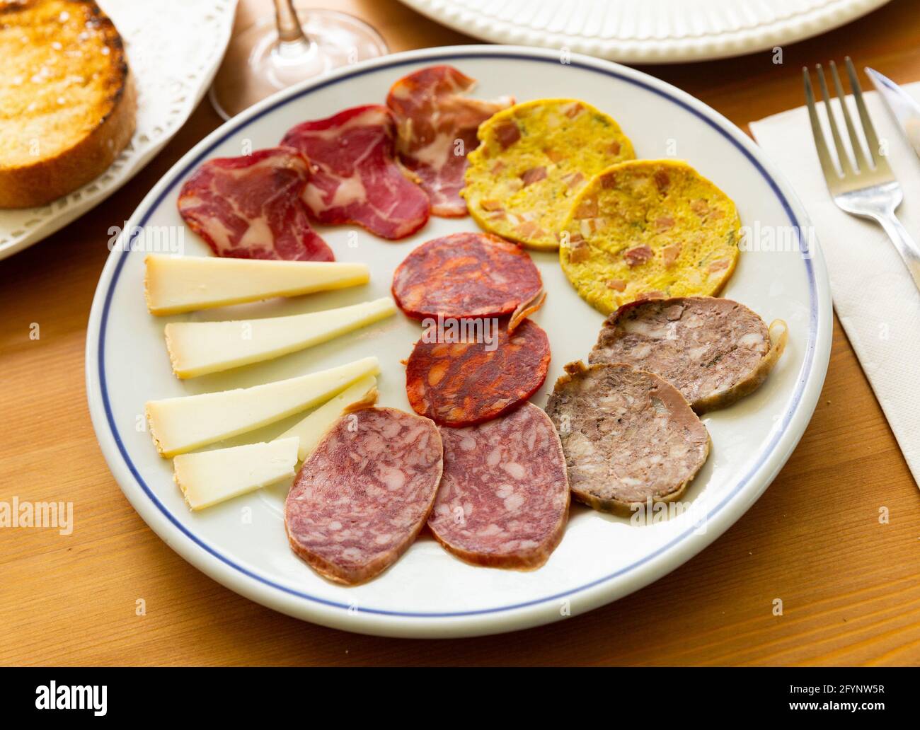 Cured meat platter with cheese and spanish sausages, slices and cuts ...