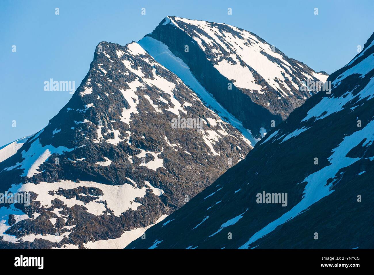 Snow covered mountains in summer Stock Photo - Alamy