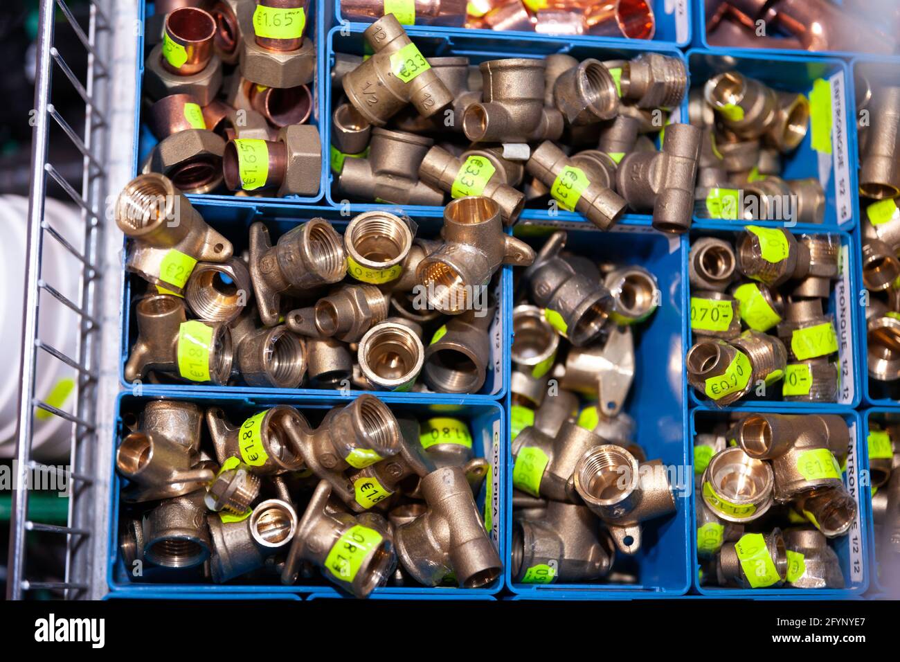 Closeup of brass, cooper and plastic pipe line accessories on display ...