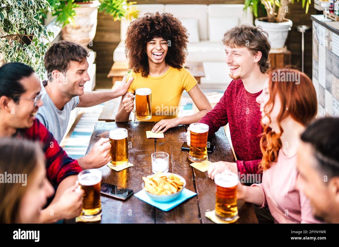 Young gen z people drinking beer at brewery bar terrace - Friendship ...