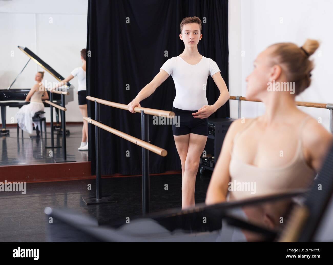 Ballet lesson in the studio. Choreographer plays the piano Stock Photo ...