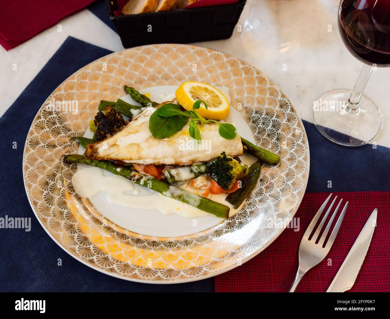 Delicious fish dish — dorado fish fillet served with boiled vegetables ...