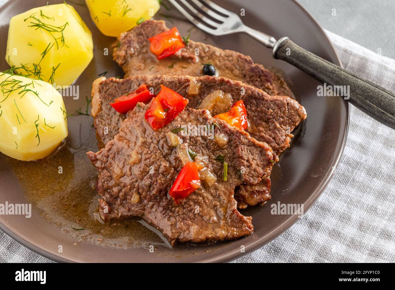 Homemade braised beef with gravy and potatoes Stock Photo - Alamy