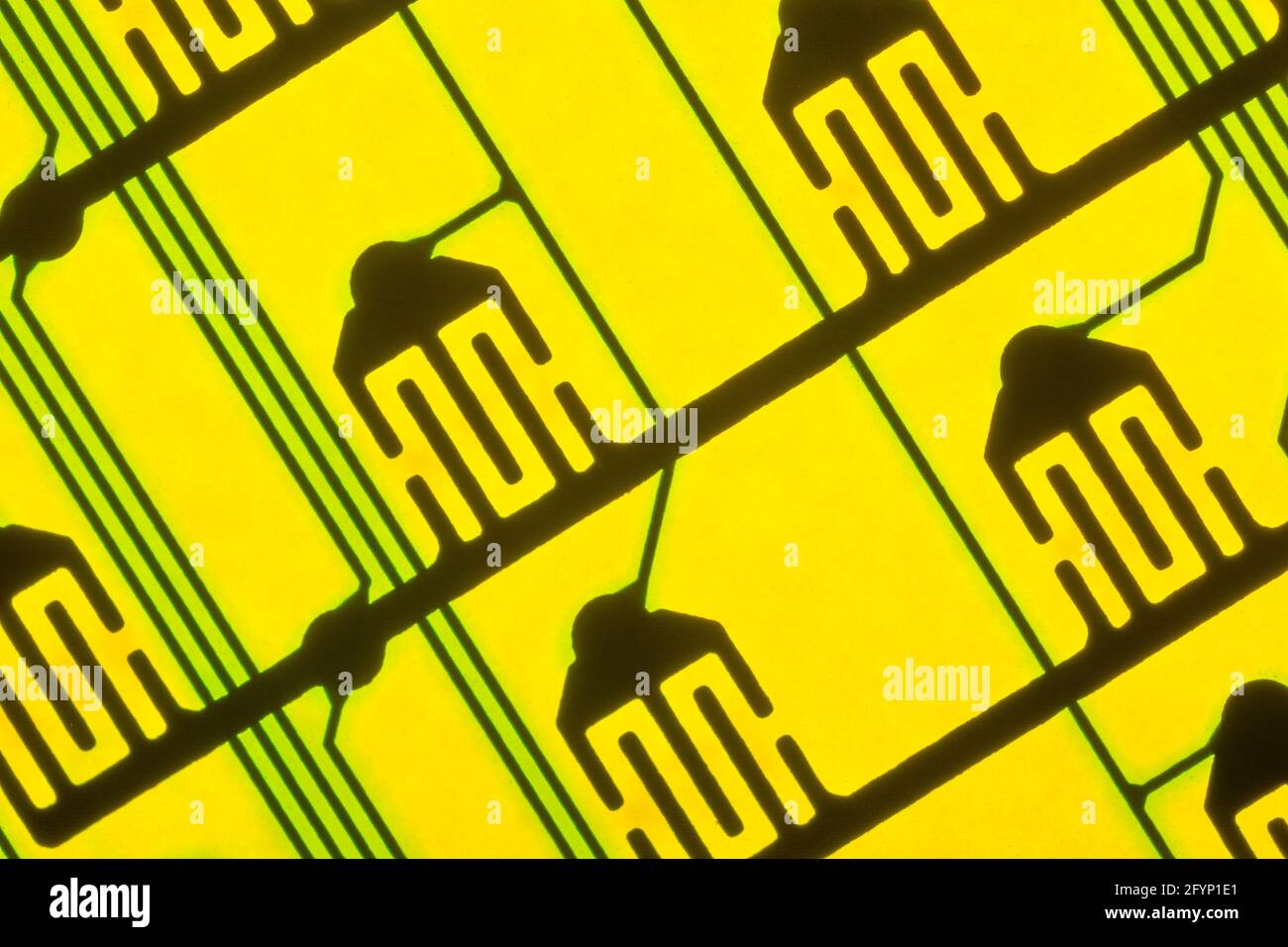 Vibrant coloured abstract macro shot of an opaque printed circuit board ...