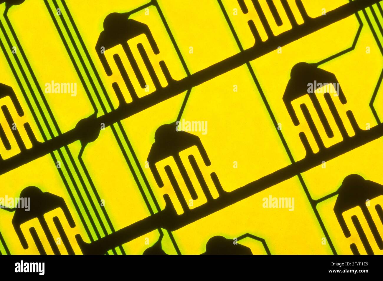 Vibrant coloured abstract macro shot of an opaque printed circuit board ...